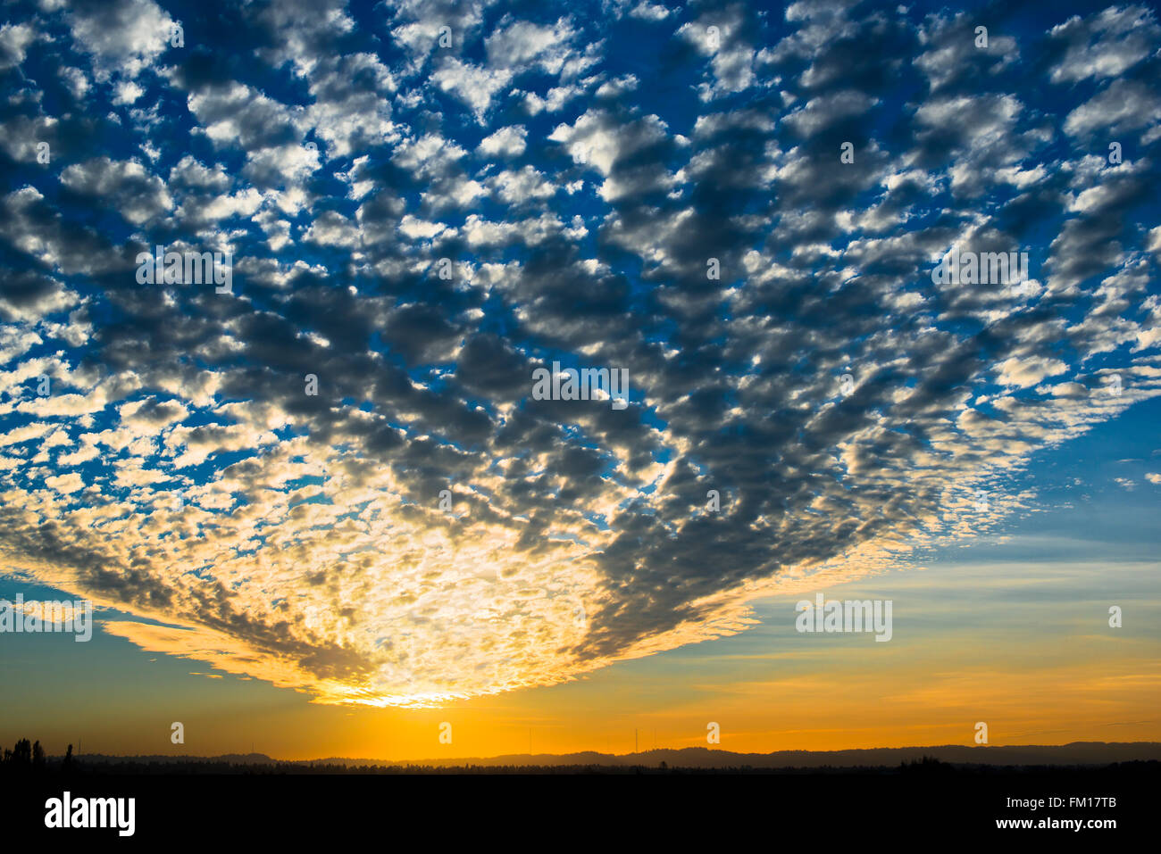 Dramatically beautiful cloudy sky from a set of small clouds gathered ...