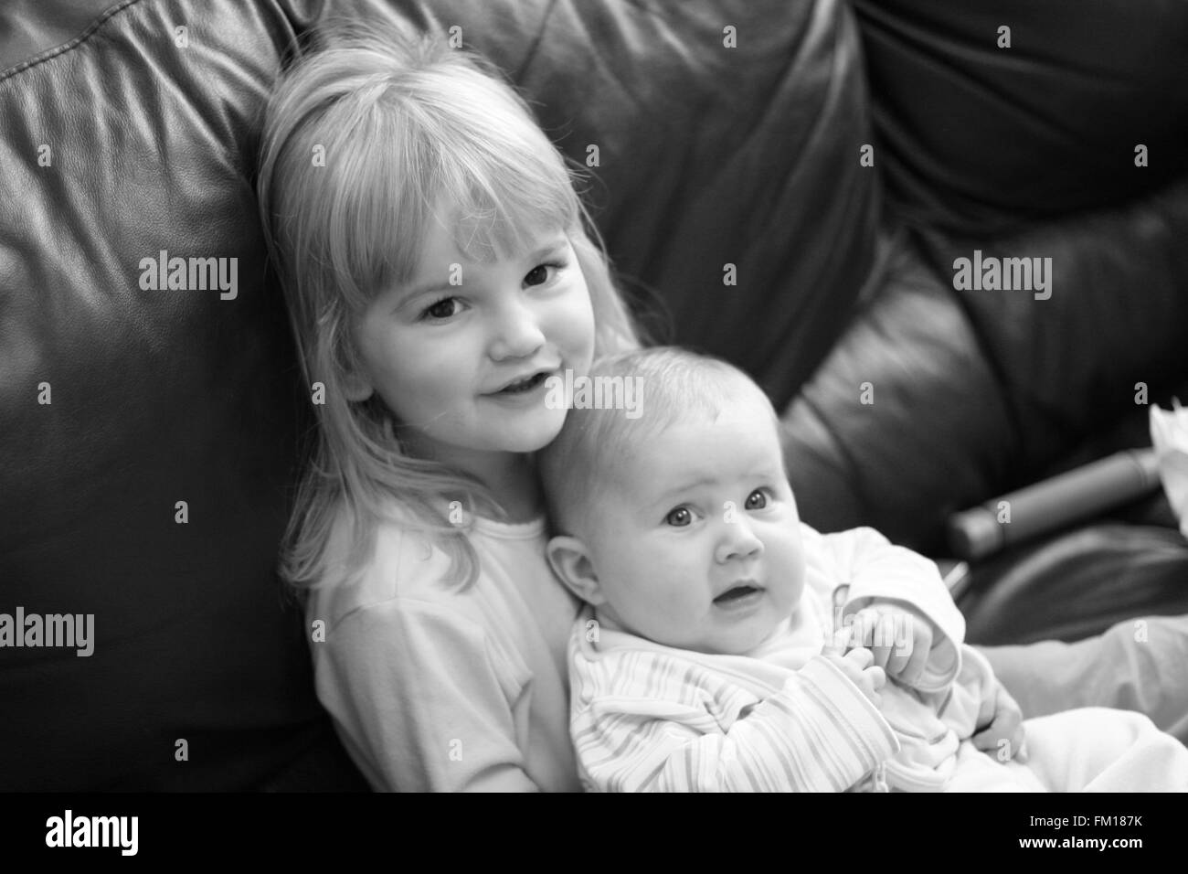 3 sisters and baby Black and White Stock Photos & Images - Alamy