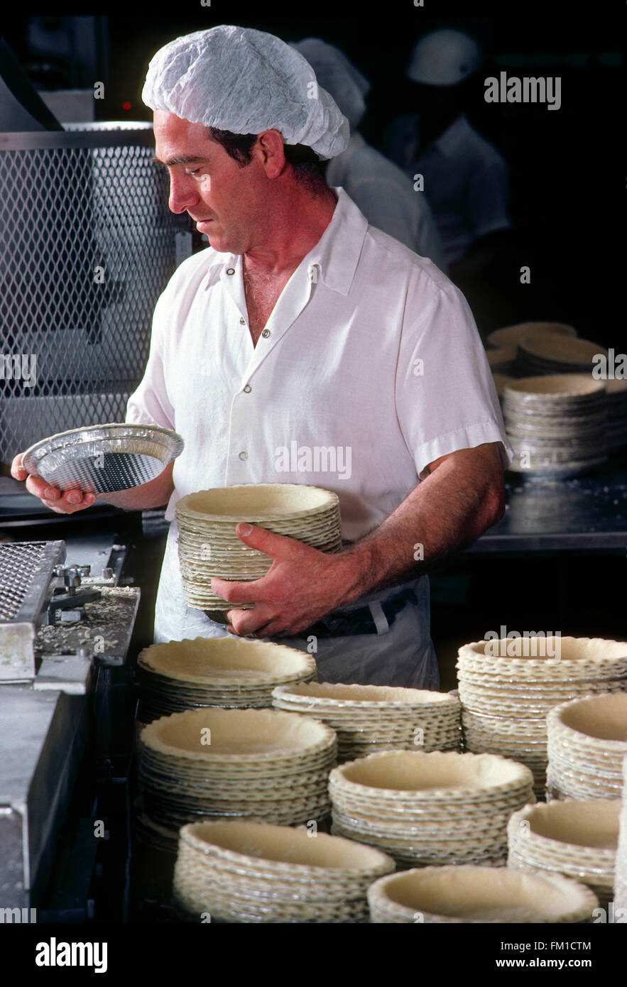 Worker on production line of Mrs. Smith's Pies, Schwan Food Company ...