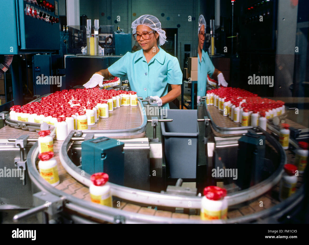 Asian factory worker performs quality control on pharmaceutical ...
