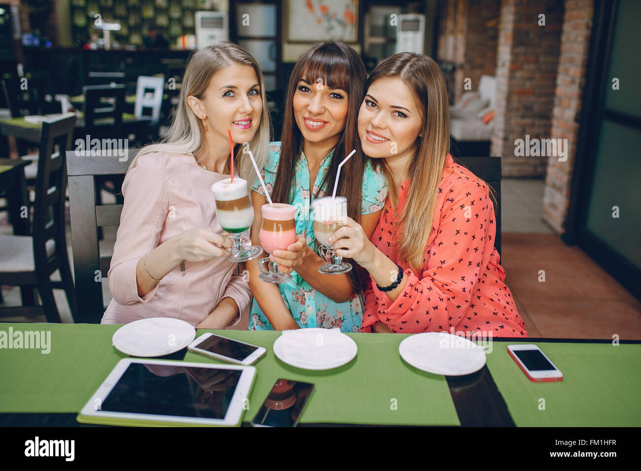Girls with phones Stock Photo - Alamy