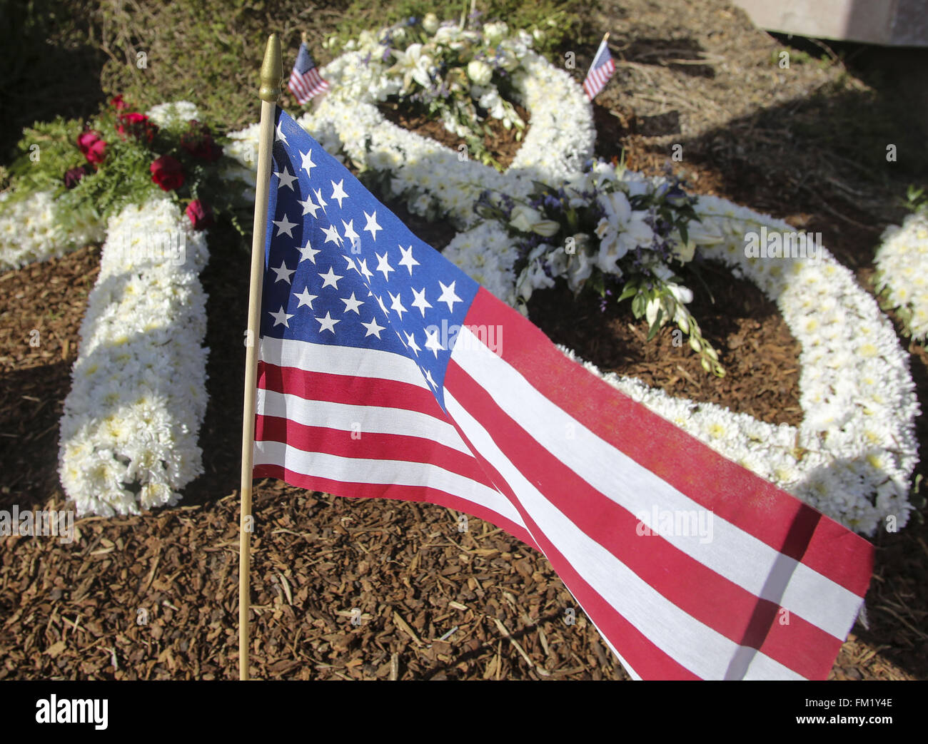 Los Angeles, California, USA. 10th Mar, 2016. Flowers are placed at a ...