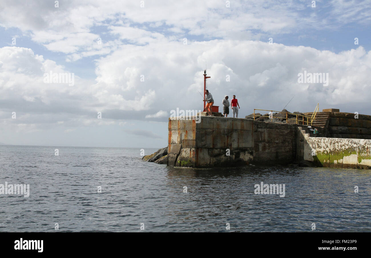 Angler fishing off harbour hi-res stock photography and images - Alamy