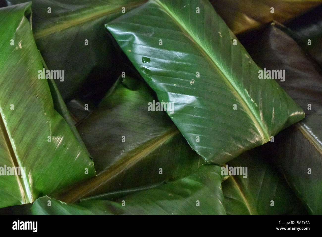 Sticky rice wrapped in banana leaves Stock Photo - Alamy