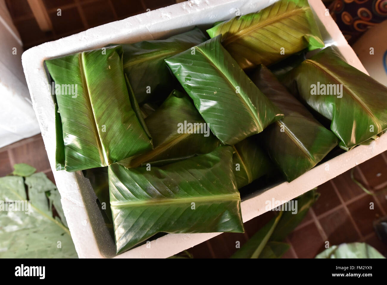 Sticky rice wrapped in banana leaves Stock Photo - Alamy