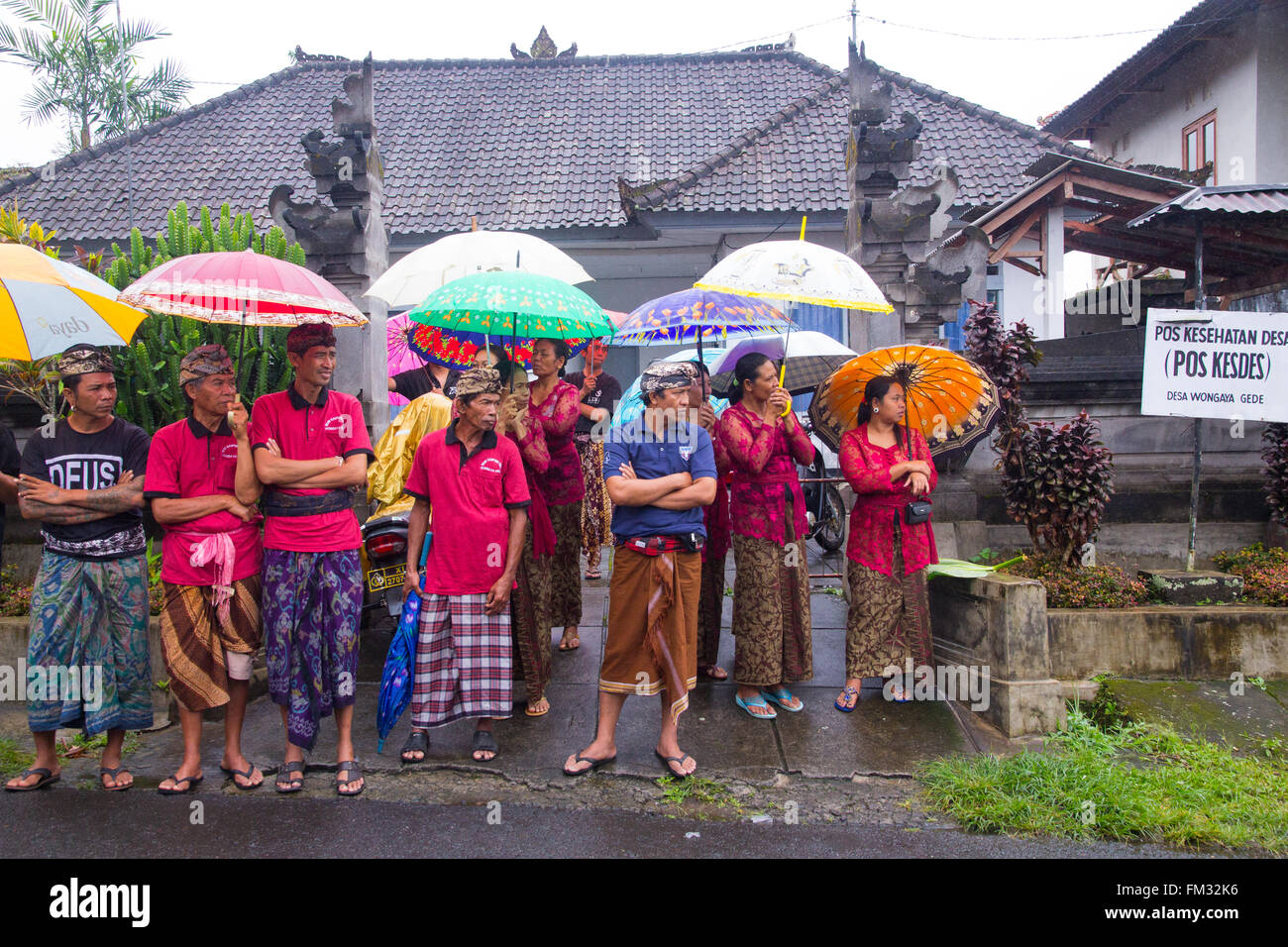 Asia, Indonesia, Bali. Group of Balinese people watching a funeral ...