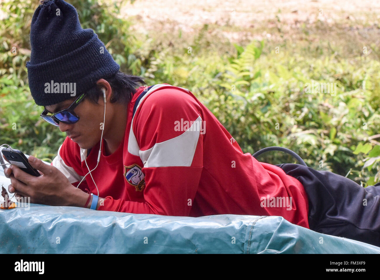 Man & mobile phone, Laos Stock Photo - Alamy