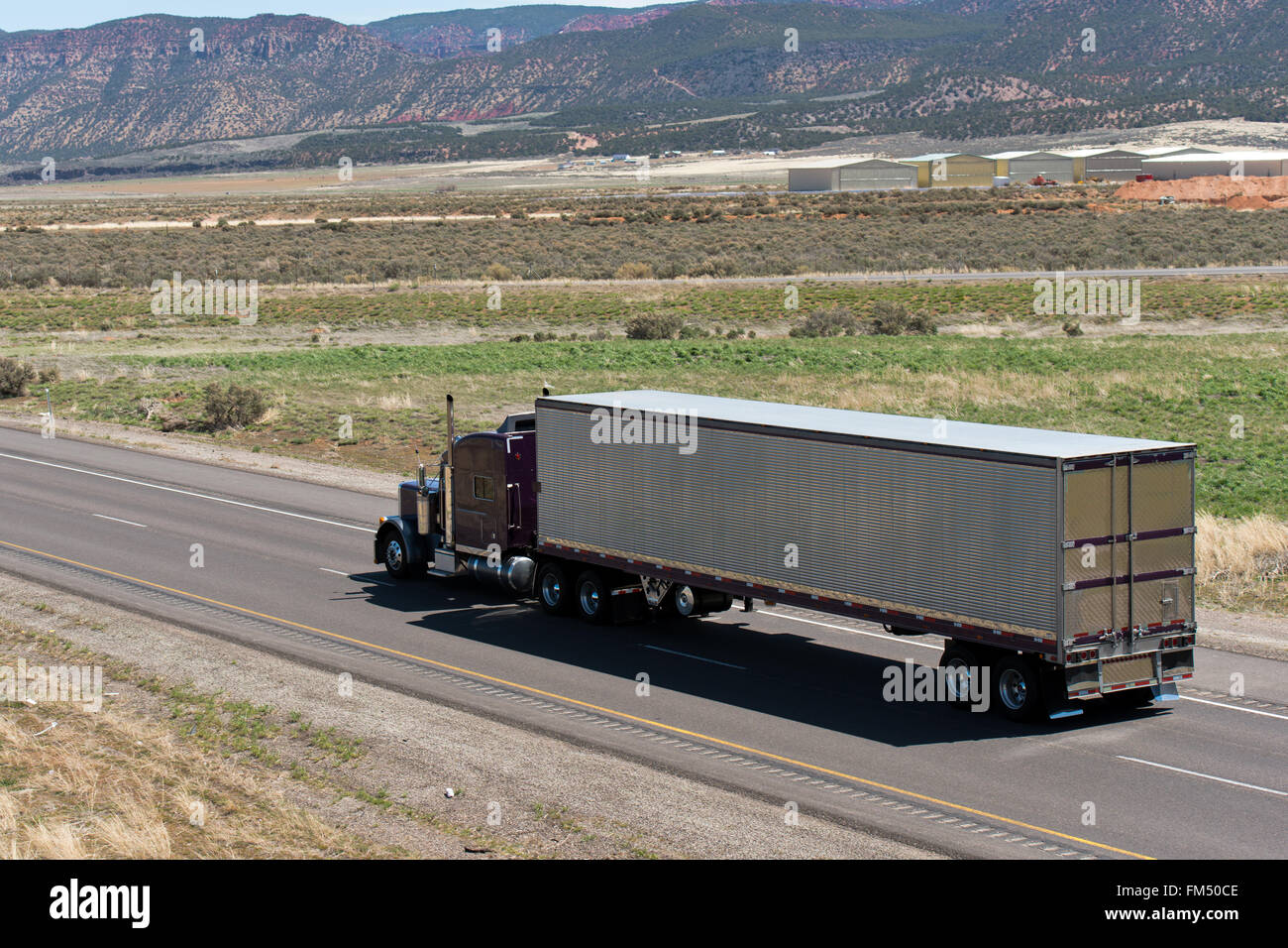 Big rig dark american classic american semi truck with reefer unit ...
