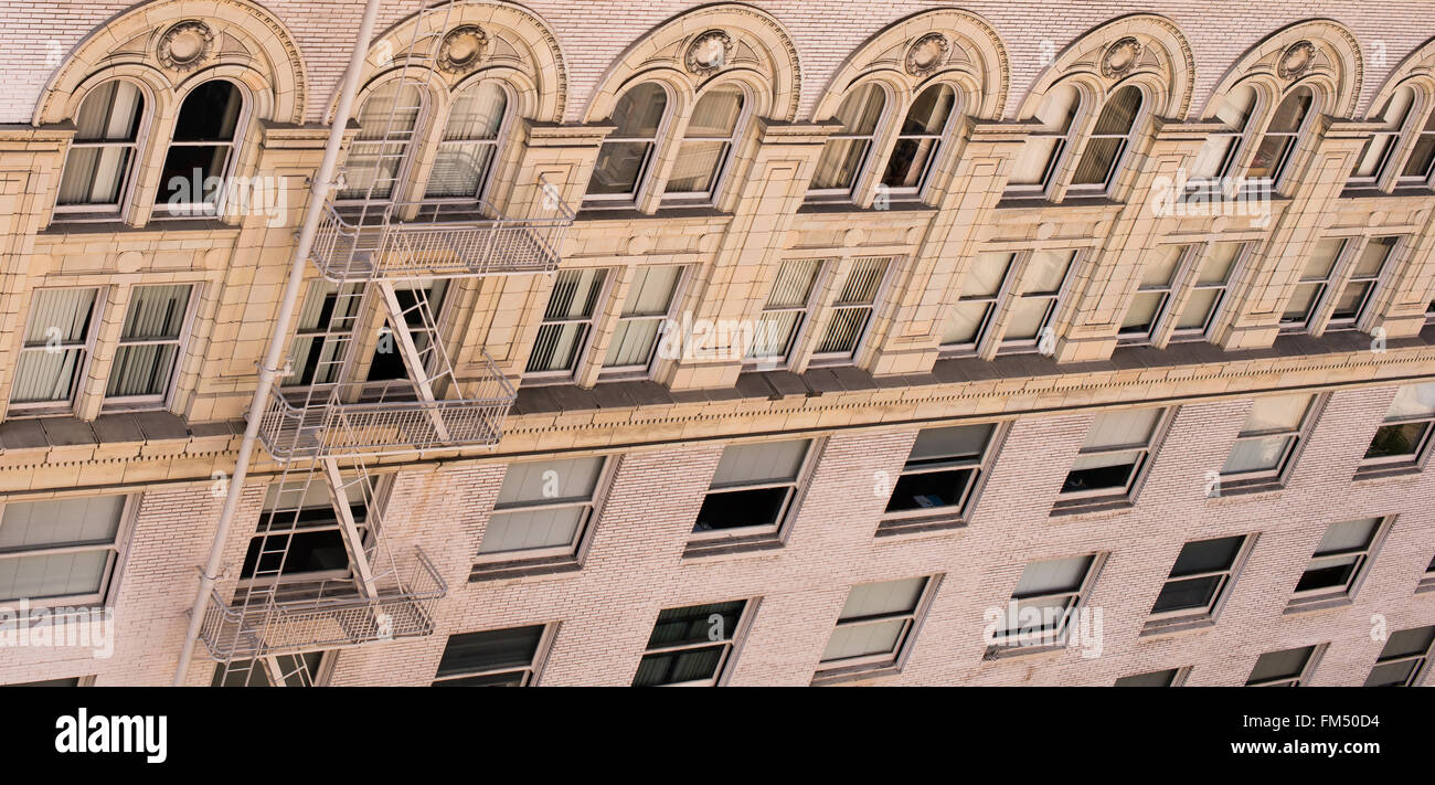 Diagonal fragments of classical high-rise building with rows of arched ...