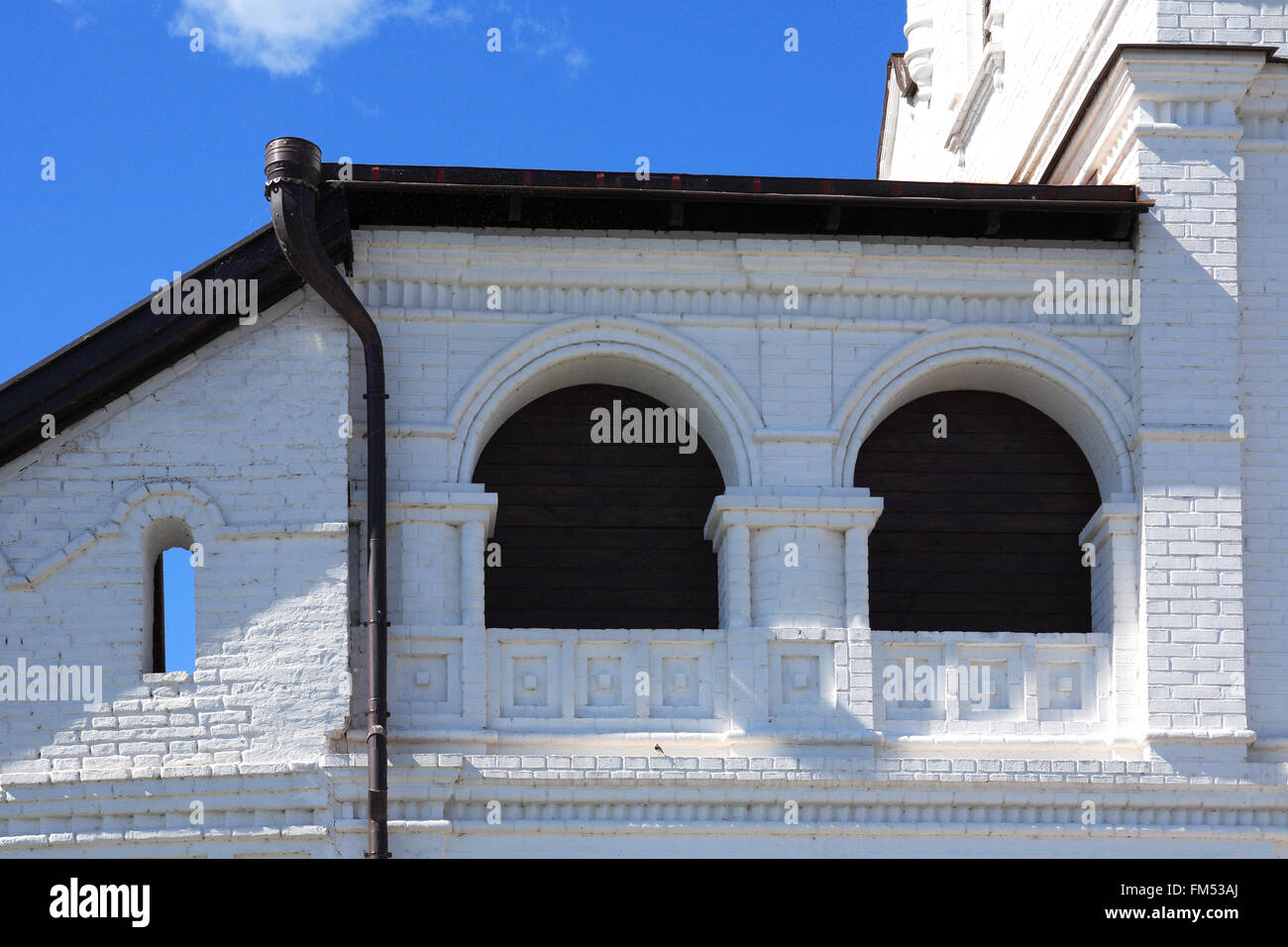 Closeup of Abbey wall with column and windows made from white stone ...