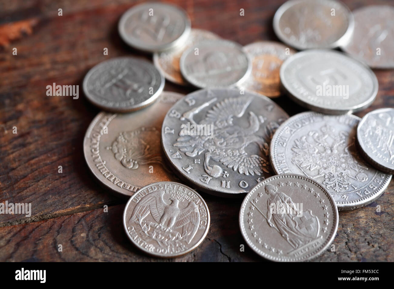 Few various coins of different countries on wooden background Stock ...