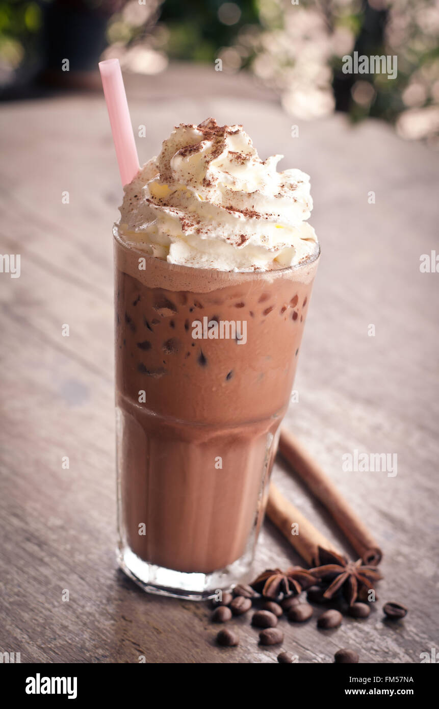 iced cocoa in a glass on wood background, vintage cocoa Stock Photo - Alamy