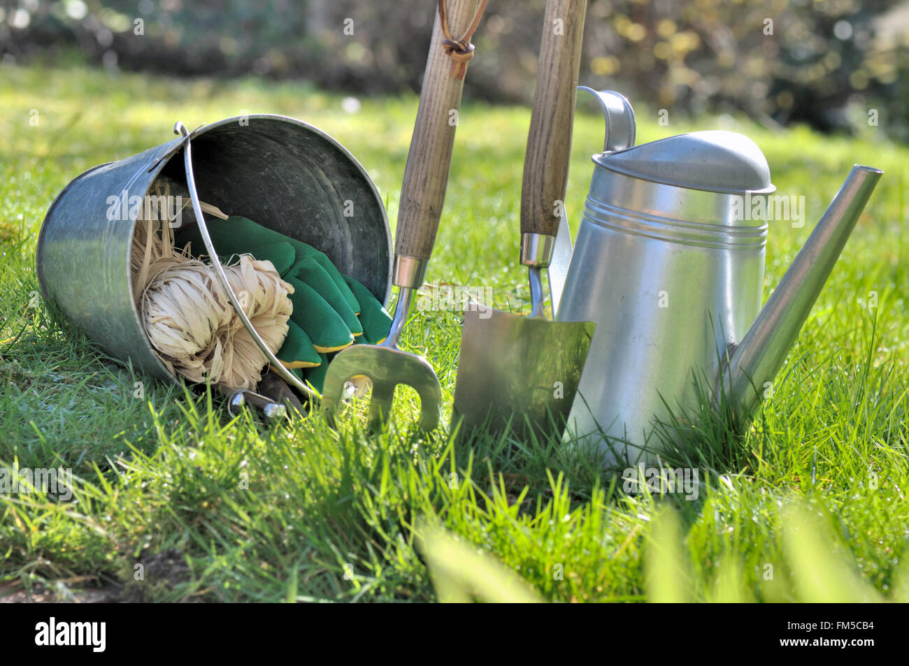 gardening metal accessories on greenery grass Stock Photo - Alamy
