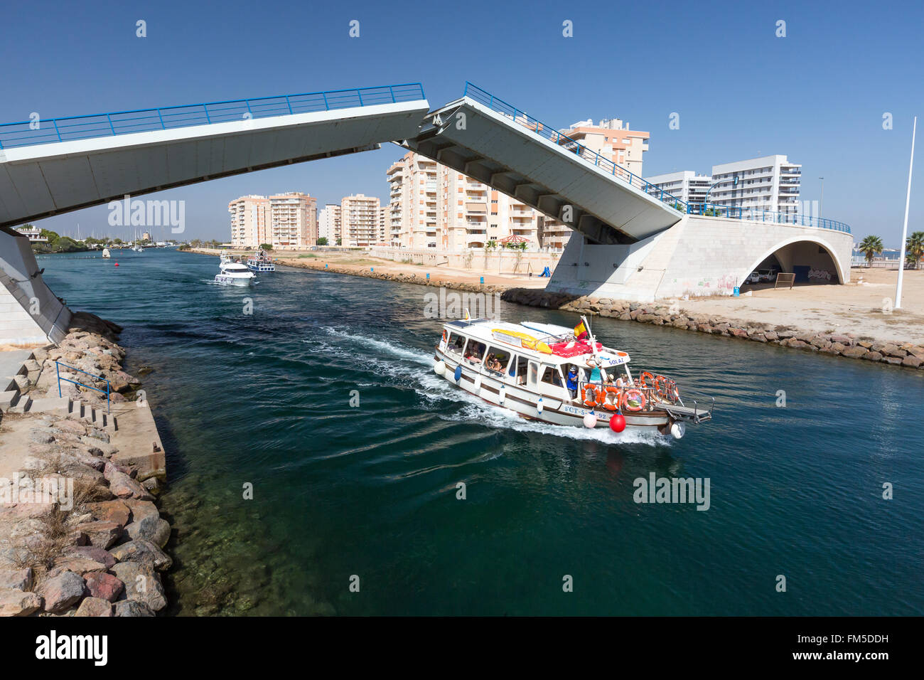 Drawbridge over water channel and boat Stock Photo - Alamy
