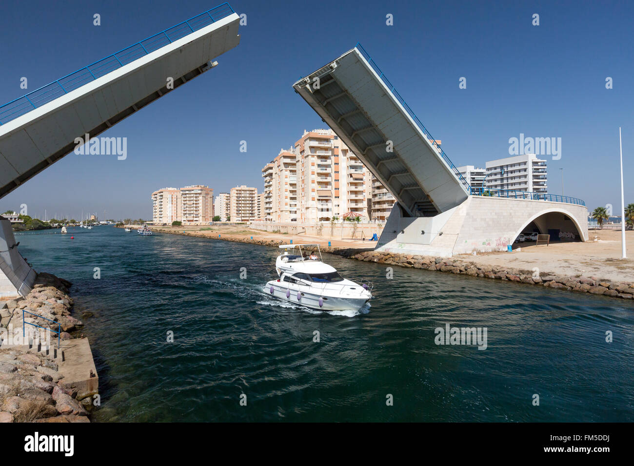 Drawbridge over water channel and boat Stock Photo - Alamy