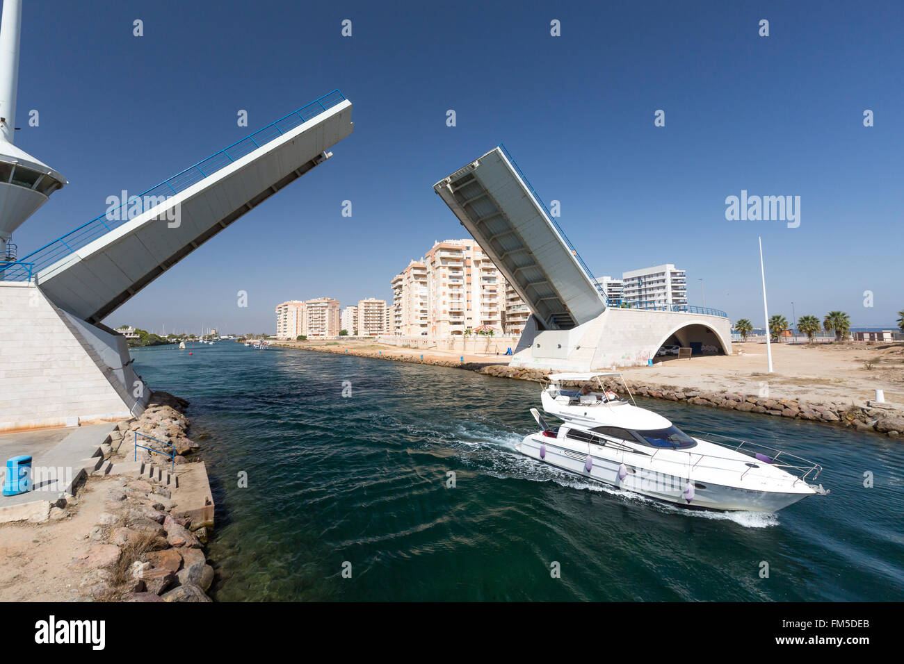 Drawbridge over water channel and boat Stock Photo - Alamy