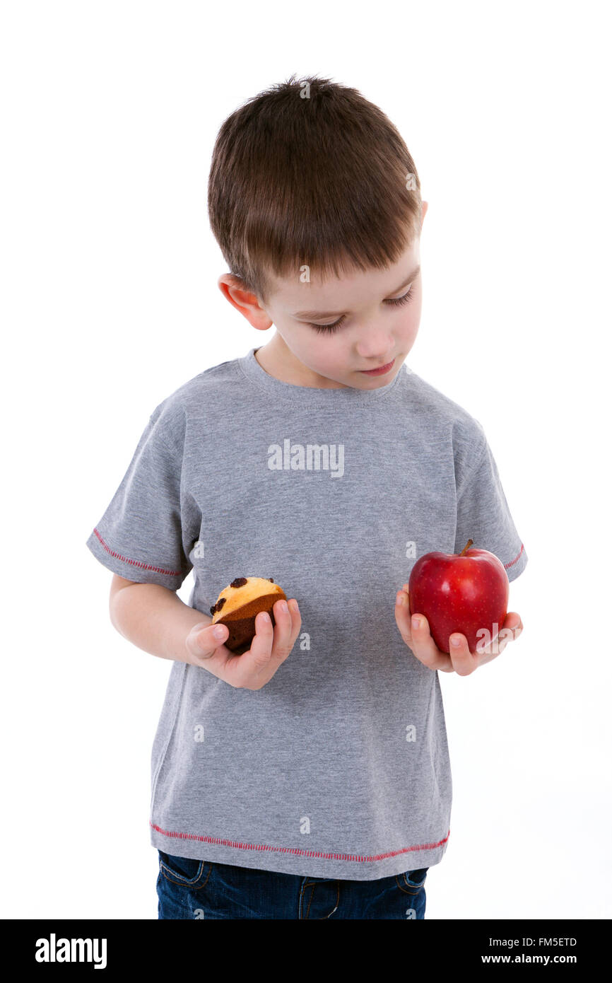 little boy with food isolated on white background - apple or a muffin ...