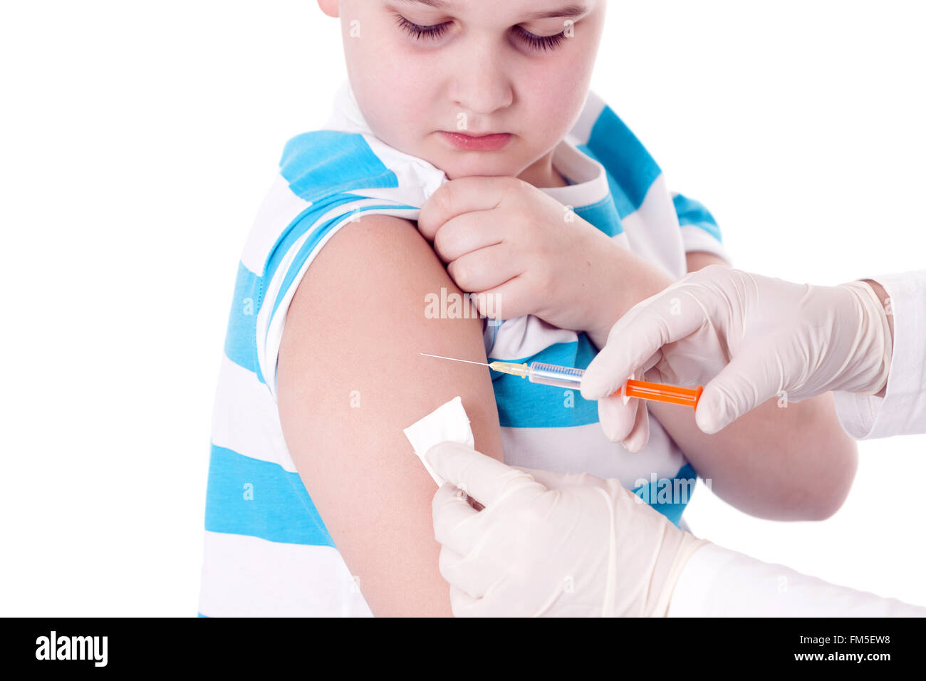 Doctor giving a child injection in arm on isolated image Stock Photo ...