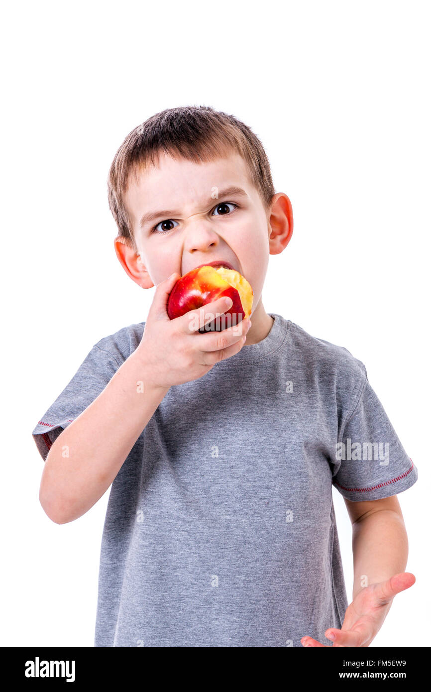 little boy with food isolated on white background - apple or a muffin ...
