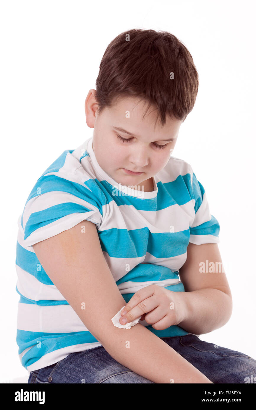 Doctor giving a child injection in arm on isolated image Stock Photo ...