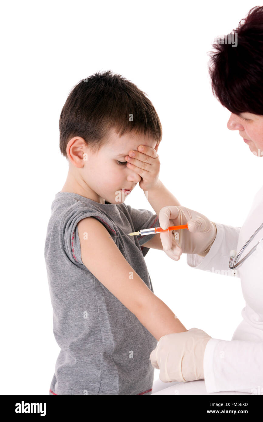 Doctor giving a child injection in arm on isolated image Stock Photo ...