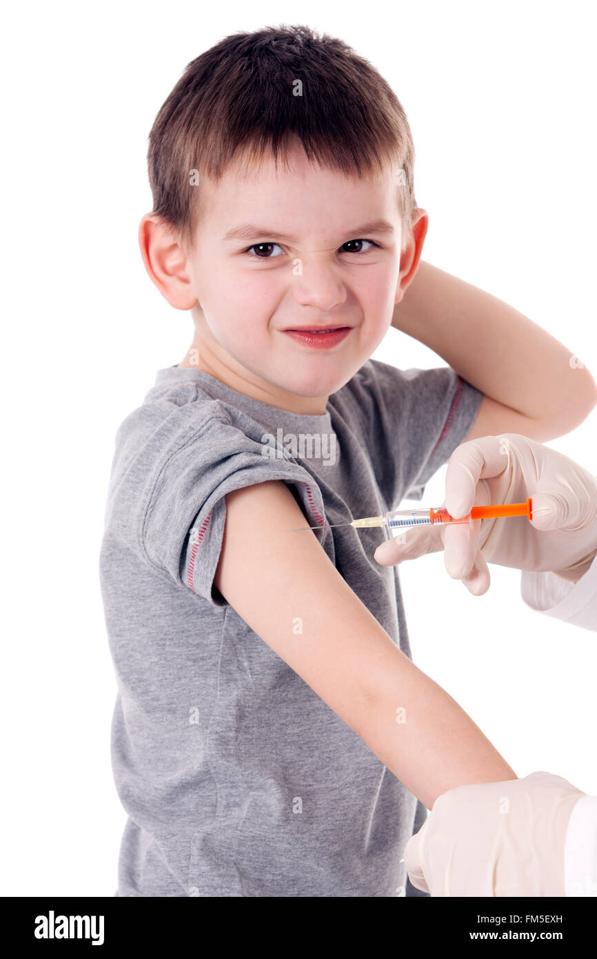 Doctor giving a child injection in arm on isolated image Stock Photo ...