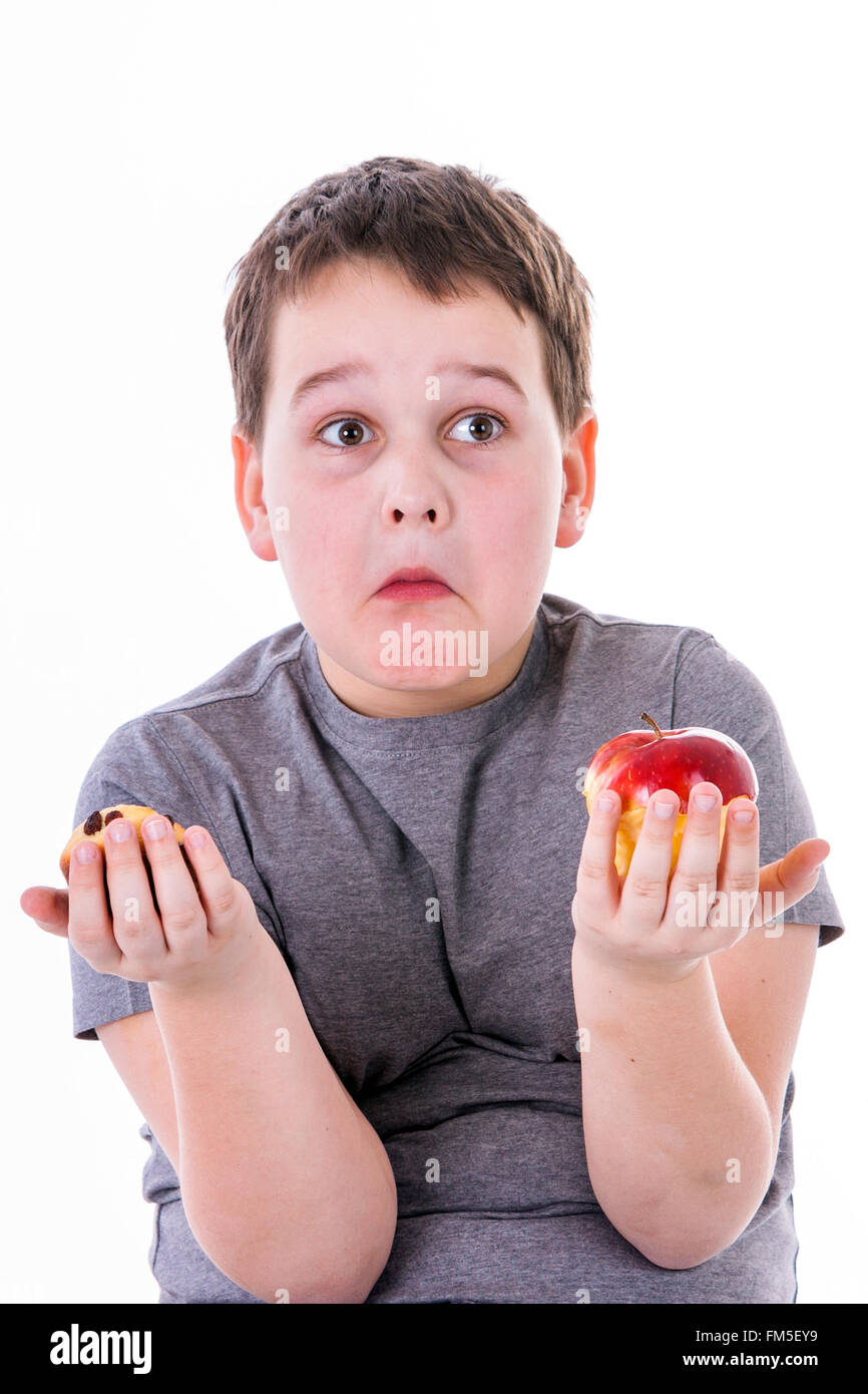 little boy with food isolated on white background - apple or a muffin ...