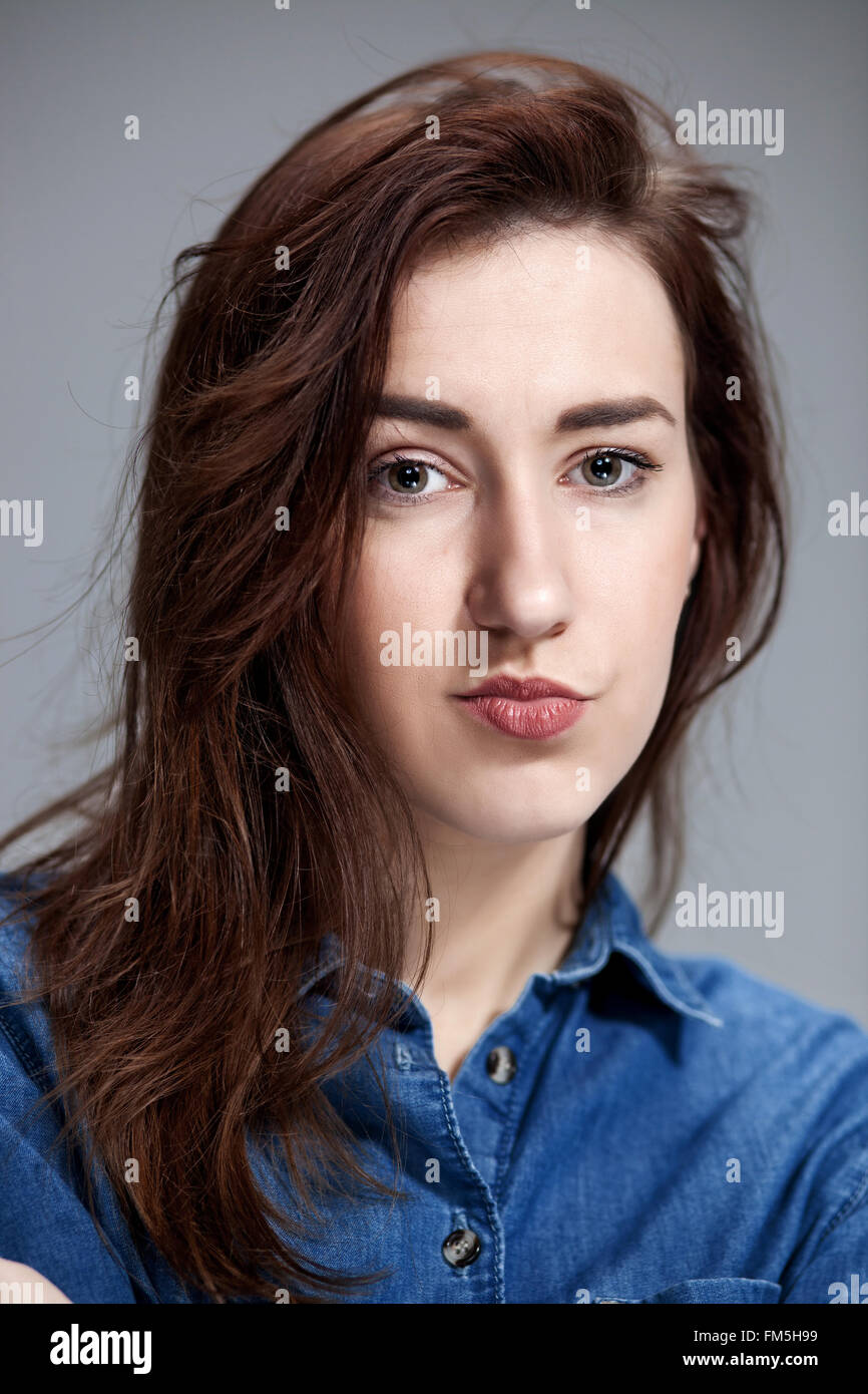 The portrait of a beautiful sad girl closeup on gray Stock Photo - Alamy