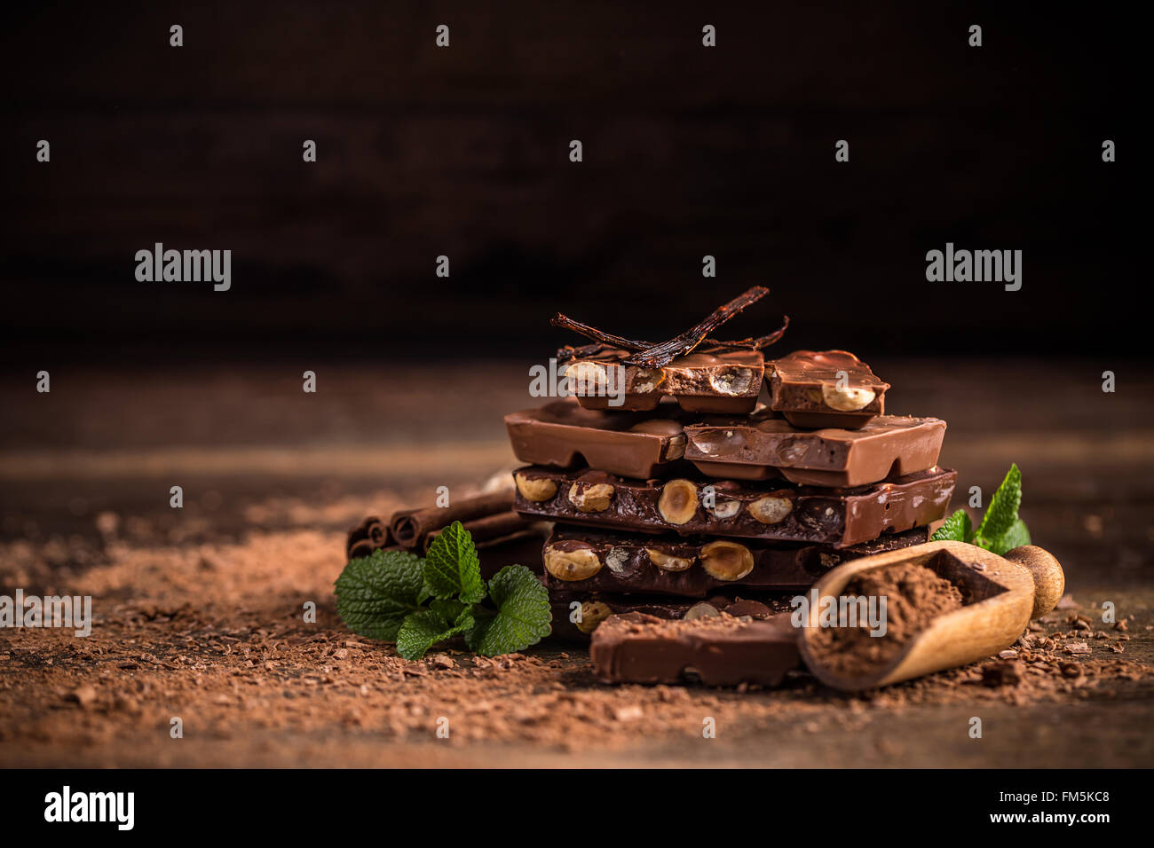 Stack of chocolate pieces with nut Stock Photo - Alamy