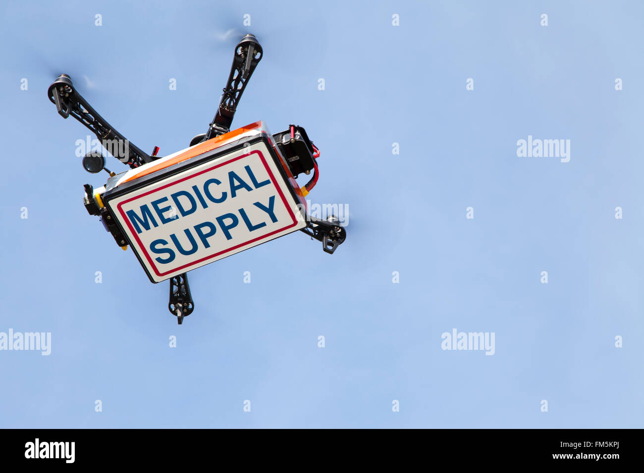 UAV drone quadrocopter with modern GPS navigation transporting box with ...