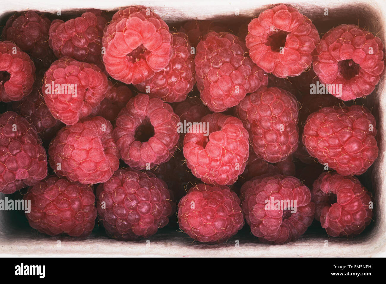 fresh raspberries top view background Stock Photo - Alamy