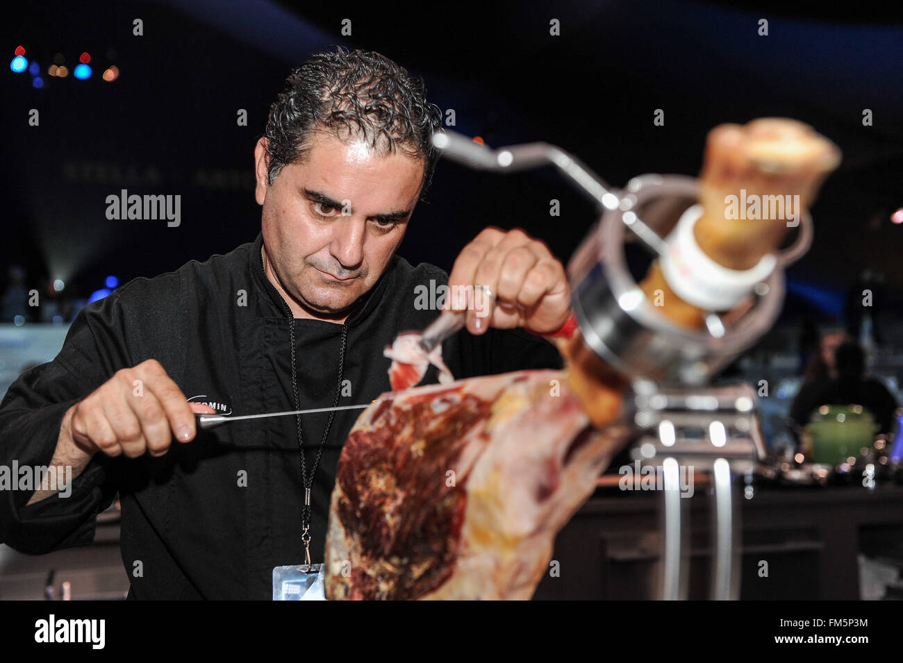 Los Angeles, USA. 9th Mar, 2016. Chef Paco Carrasco slices Jamon, a ...