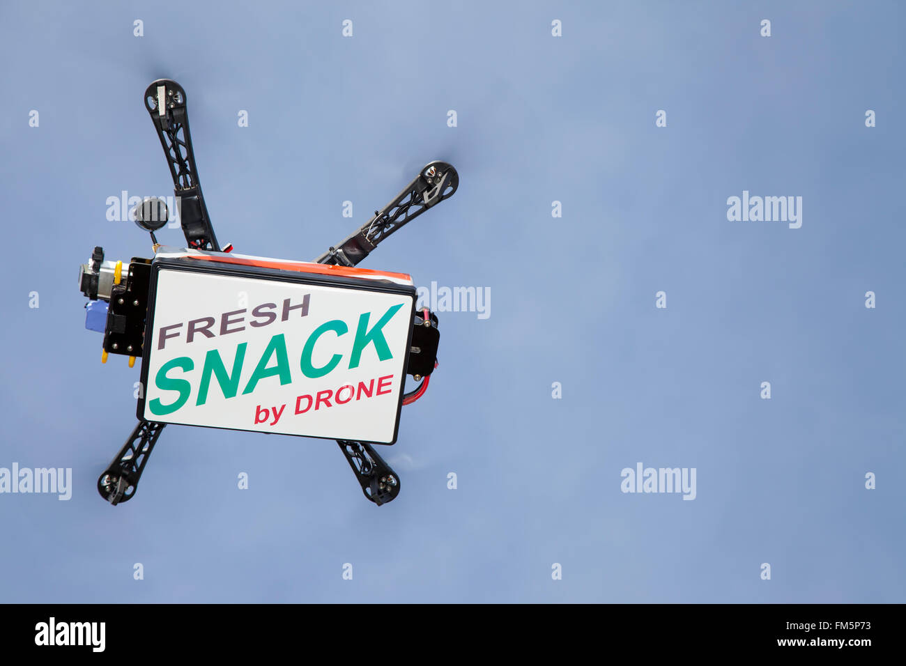 UAV drone quadrocopter with modern GPS navigation transporting fresh ...