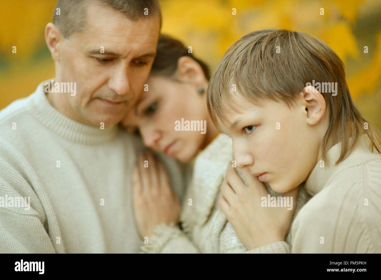 Portrait of a sad family Stock Photo - Alamy