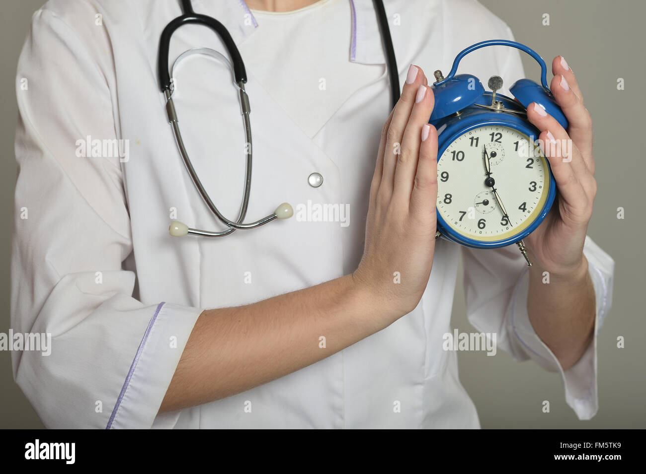doctor with clock Stock Photo - Alamy