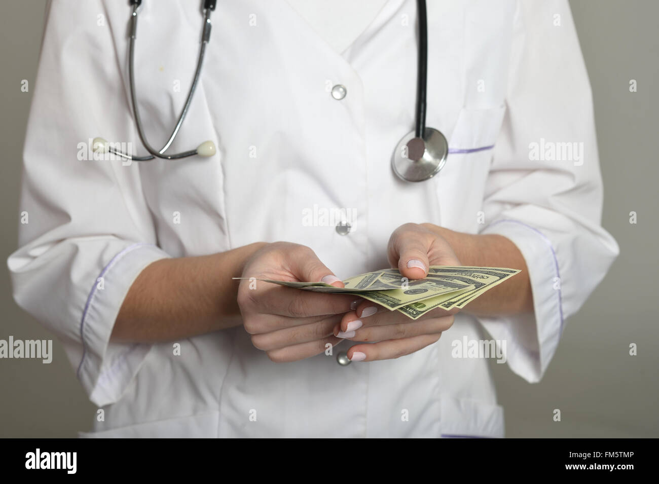 doctor with money Stock Photo - Alamy