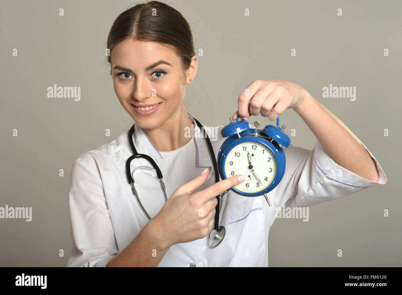 doctor with clock Stock Photo - Alamy