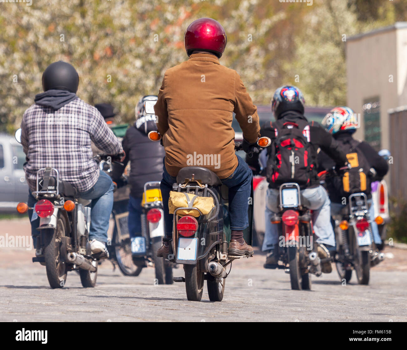 german small mopeds with drivers on a street Stock Photo - Alamy