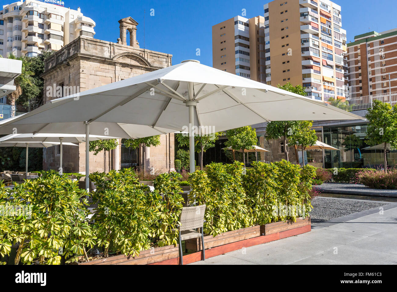 Street cafe with sunshade Stock Photo - Alamy