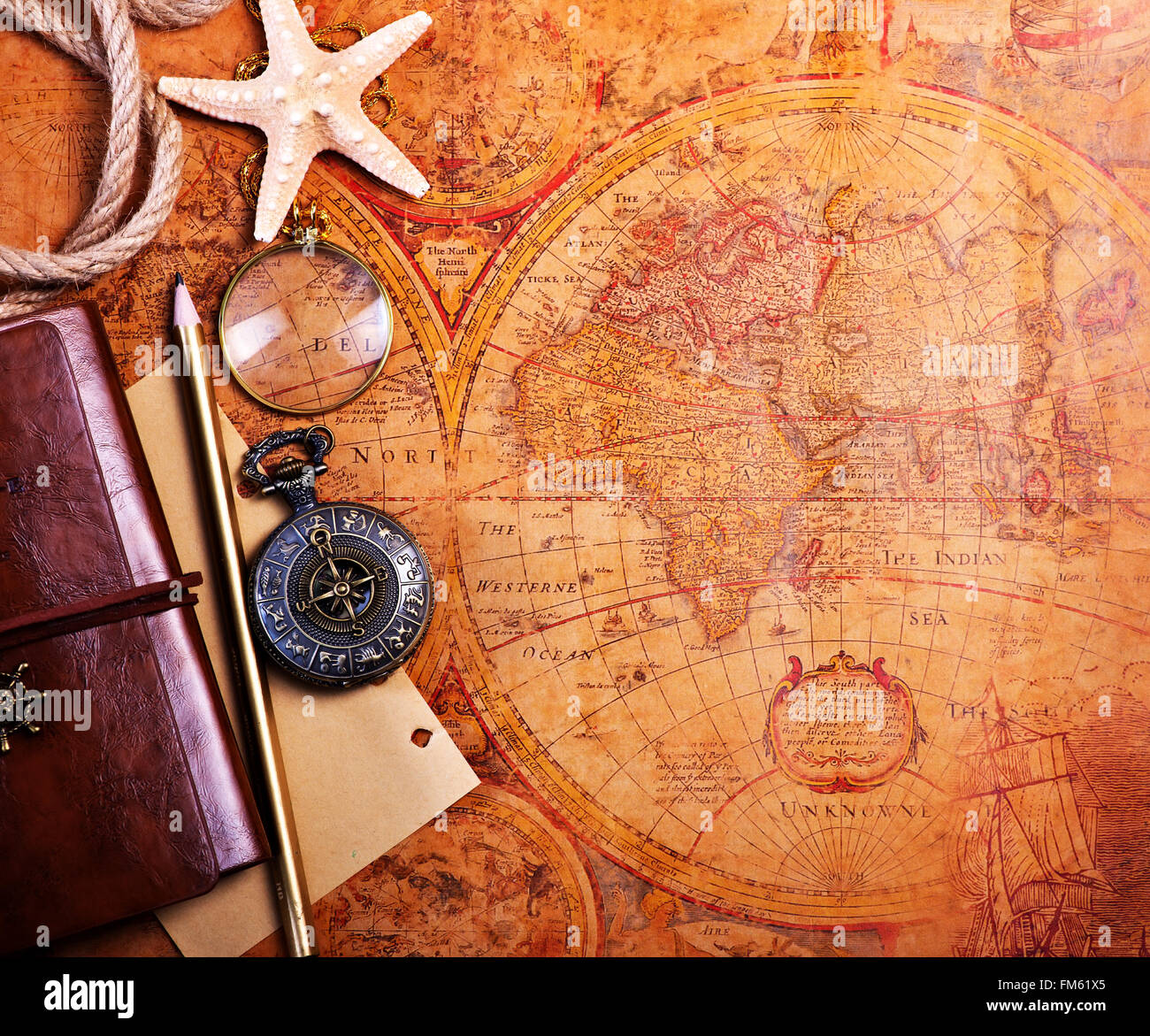 old notebook, loupe and compass on the map Stock Photo - Alamy