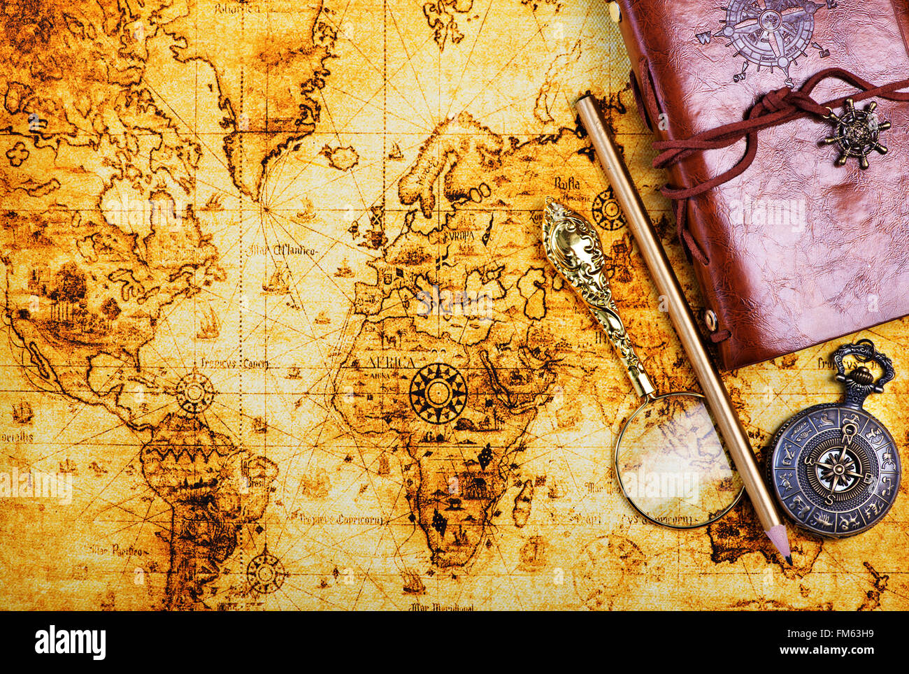 old notebook, loupe and compass on the map Stock Photo - Alamy