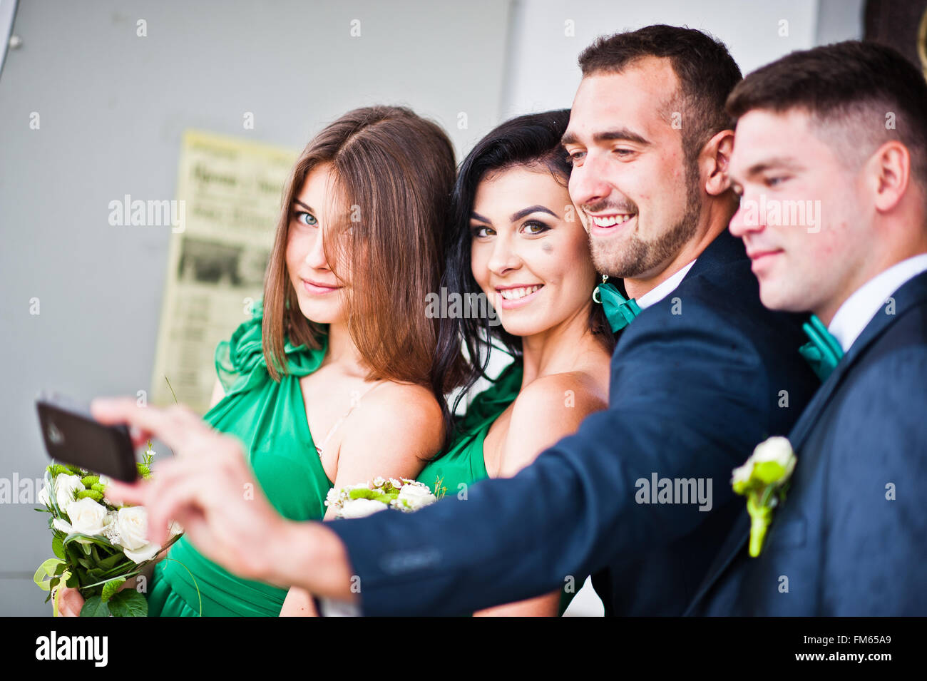 Group of four friends and bridesmaids make selfie Stock Photo - Alamy