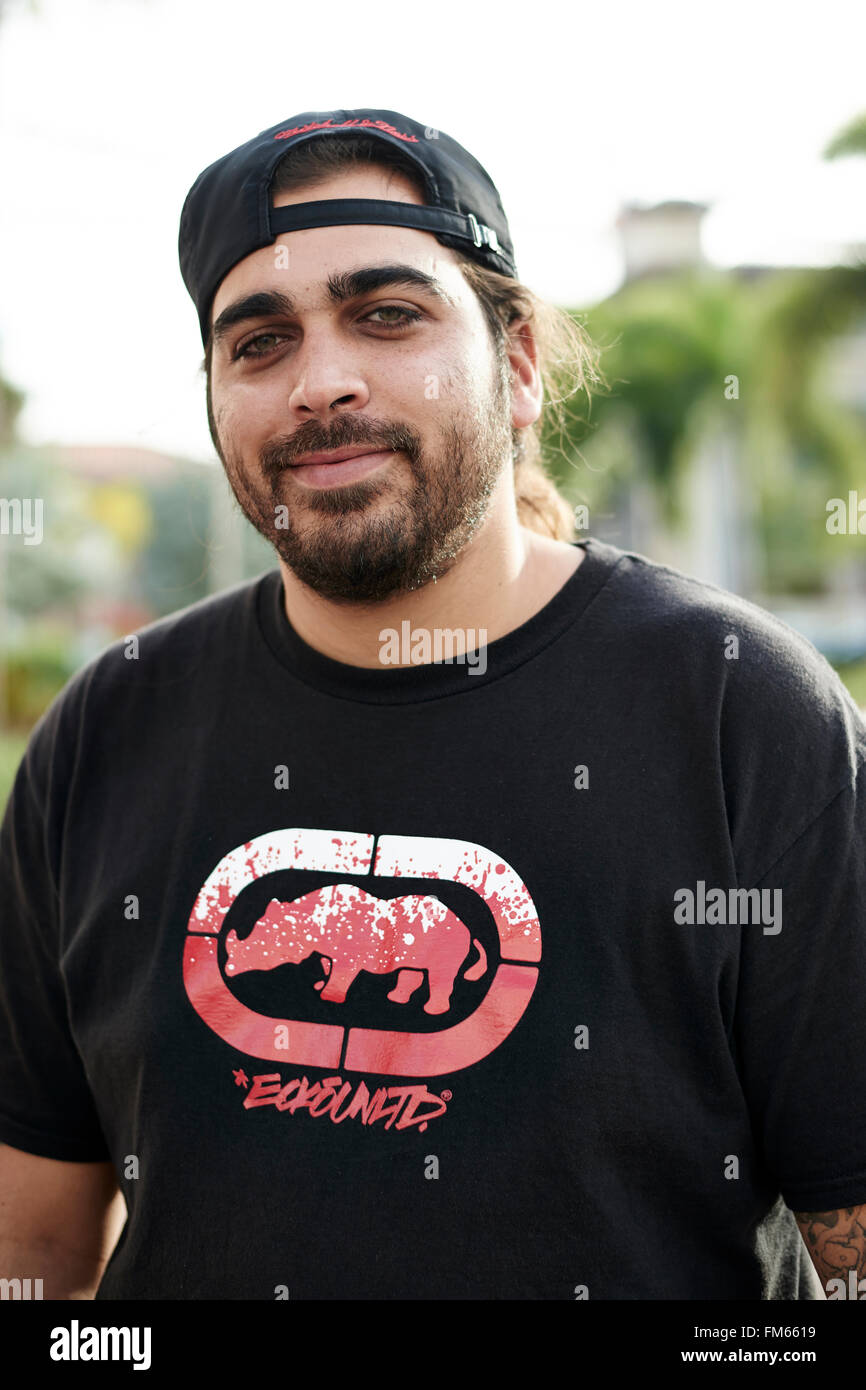 Young man with beard looks smiling at the camera Stock Photo - Alamy