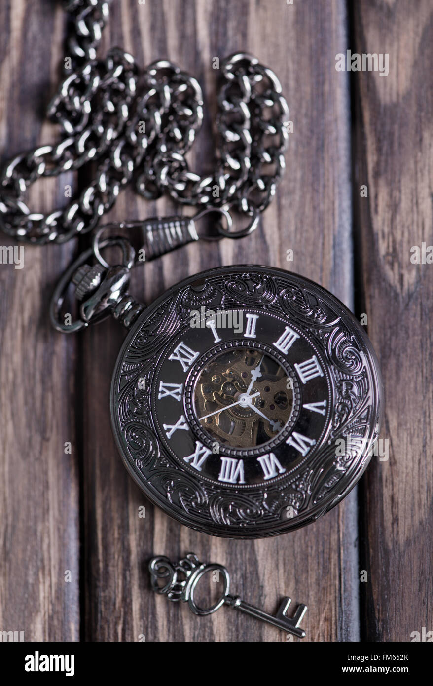 Vintage pocket watch and hour glass or sand timer, symbols of time with ...