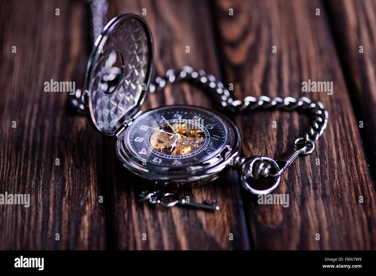 Vintage pocket watch and hour glass or sand timer, symbols of time with ...