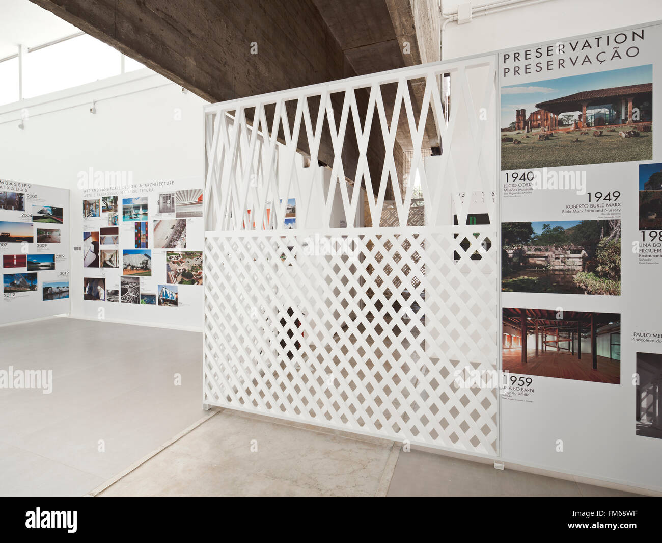 An interior view of a modern exhibition, showing photos through the ...