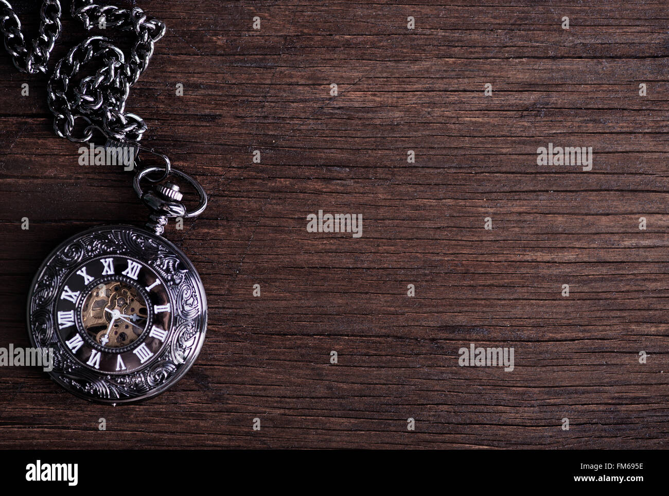 Vintage pocket watch and hour glass or sand timer, symbols of time with ...