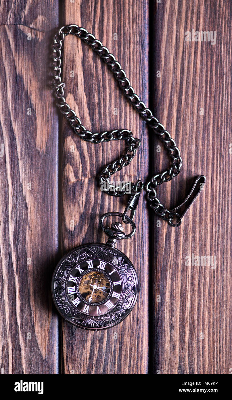 Vintage pocket watch and hour glass or sand timer, symbols of time with ...