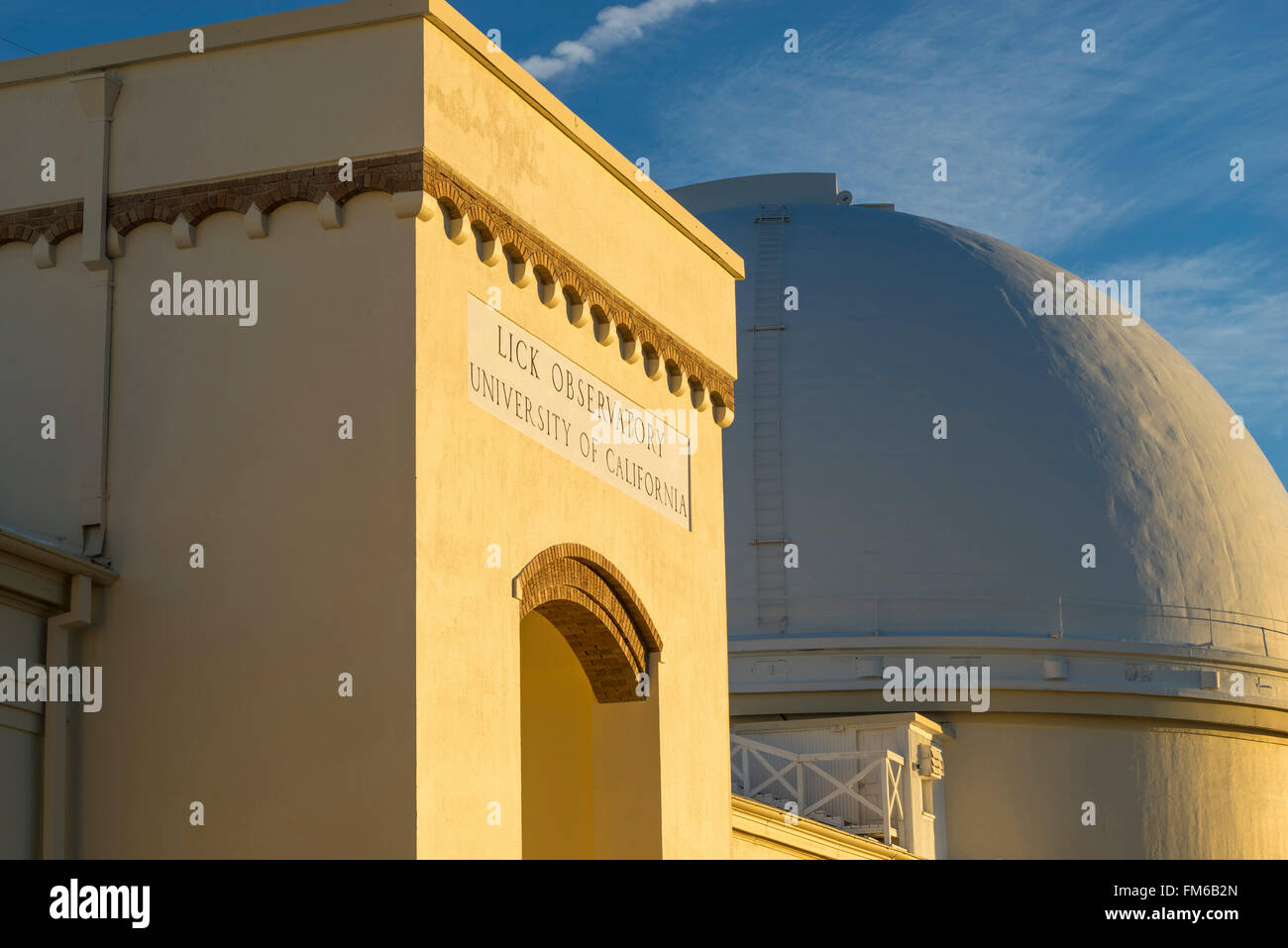 An exterior view of part of a large building showing a yellow ...
