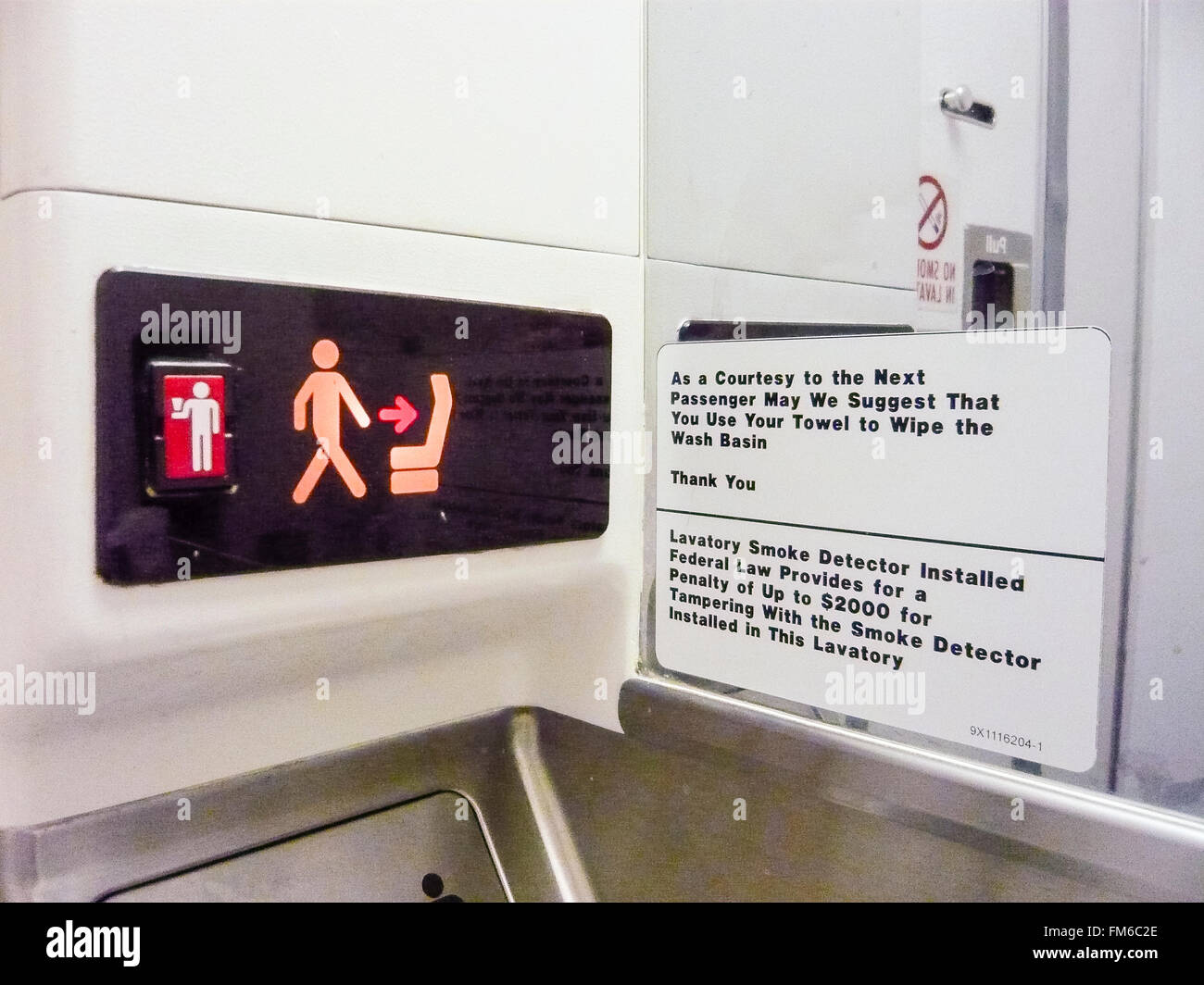 Illuminated "Fasten seatbelts" sign in the toilet of a Boeing aircraft ...